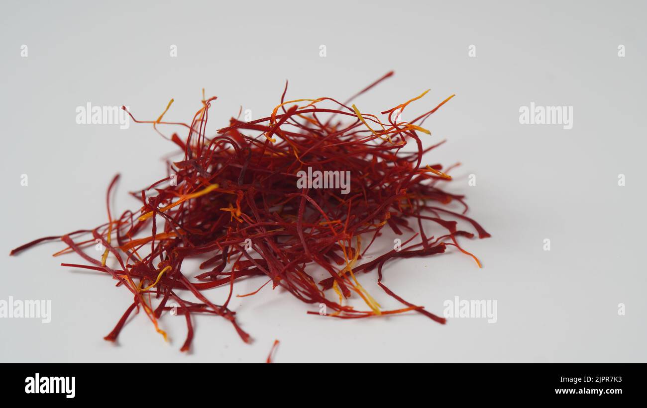 Expensive Red Dried saffron spice on white background Stock Photo - Alamy