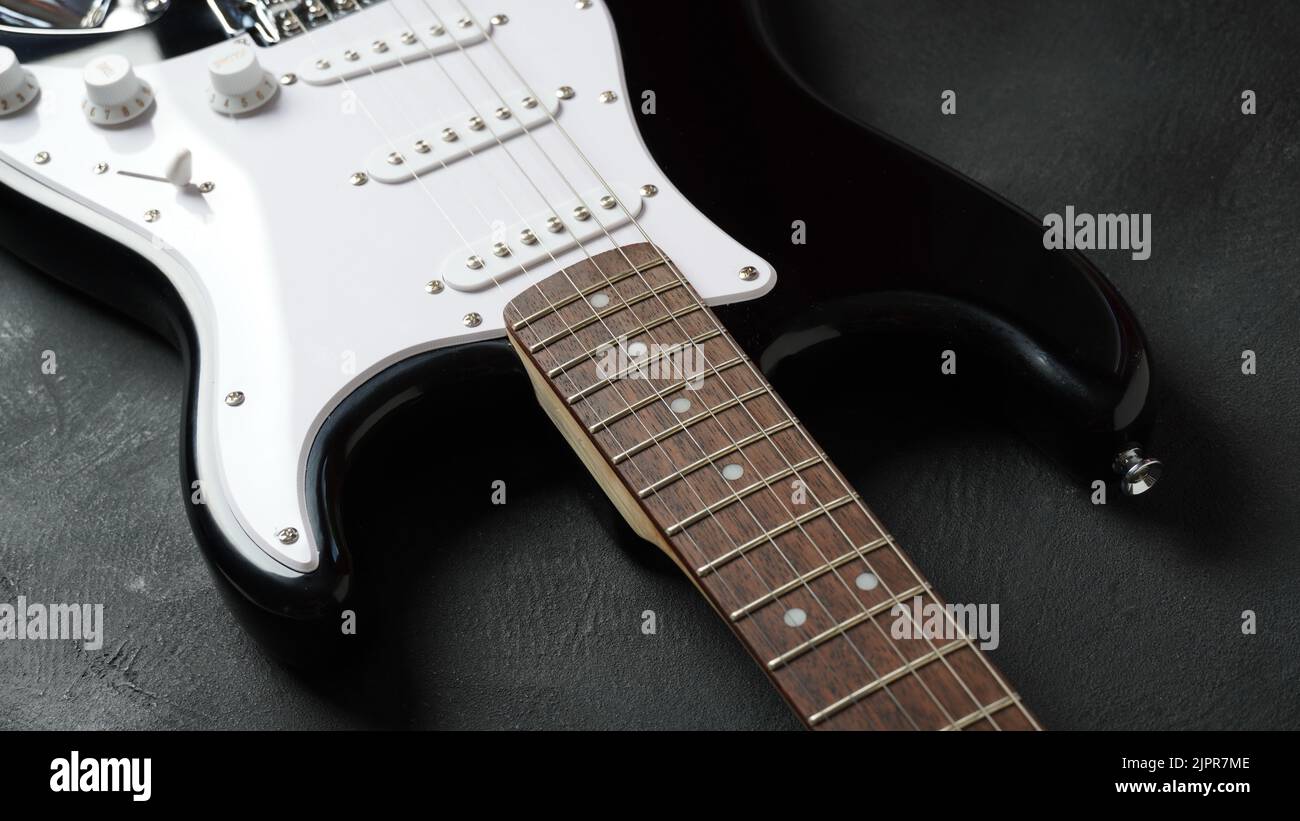 Front of electric guitar body on dark background Stock Photo - Alamy