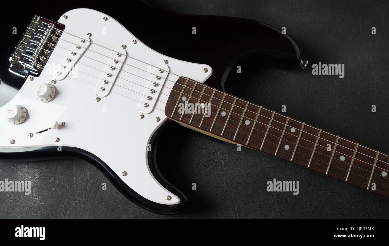 Front of electric guitar body on dark background Stock Photo - Alamy