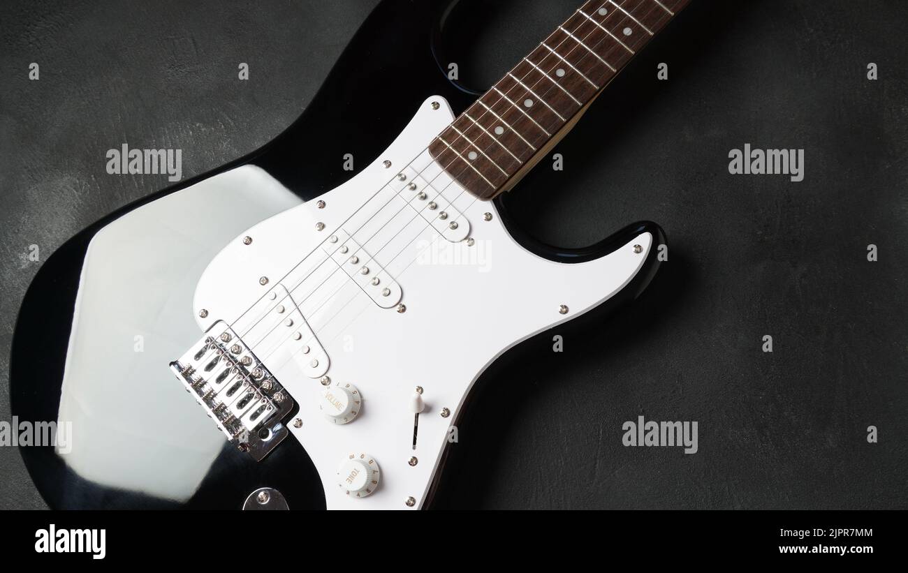 Front of electric guitar body on dark background Stock Photo - Alamy