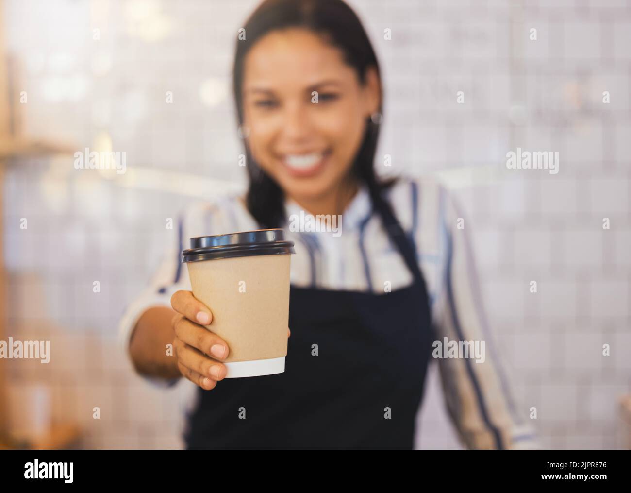 Coffee shop, closeup and barista holding cup and giving it to the ...