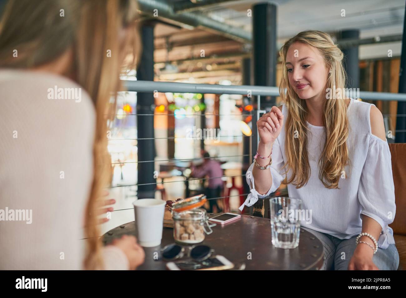 Two friends chatting in a cafe hi-res stock photography and images - Alamy