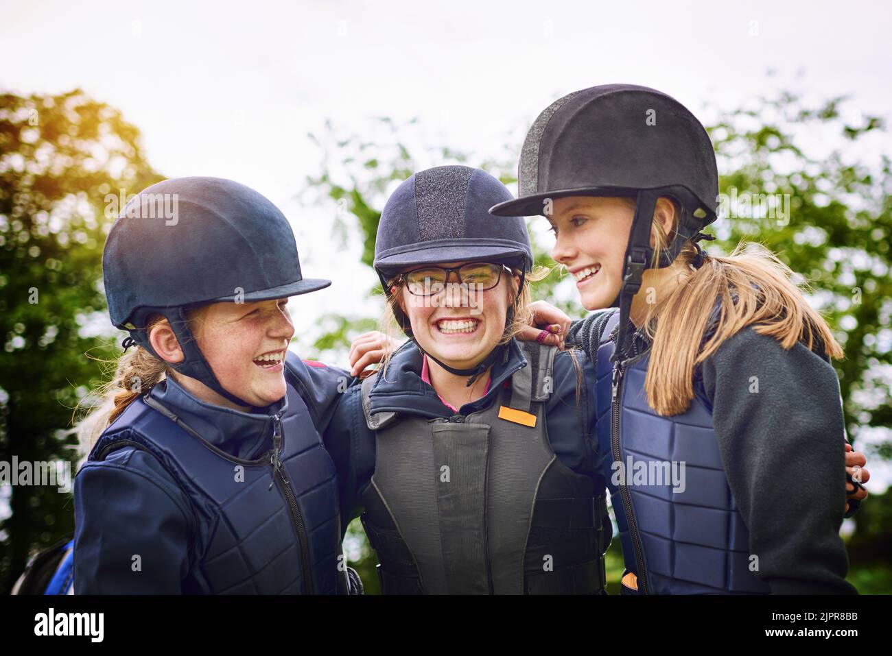 Happiest when we get to ride. Portrait of a group of young friends ...