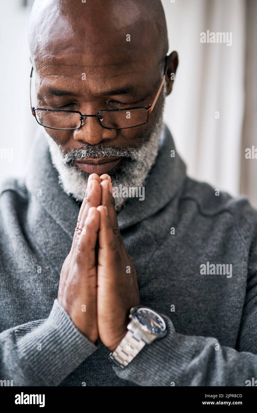 Single man praying hi-res stock photography and images - Alamy