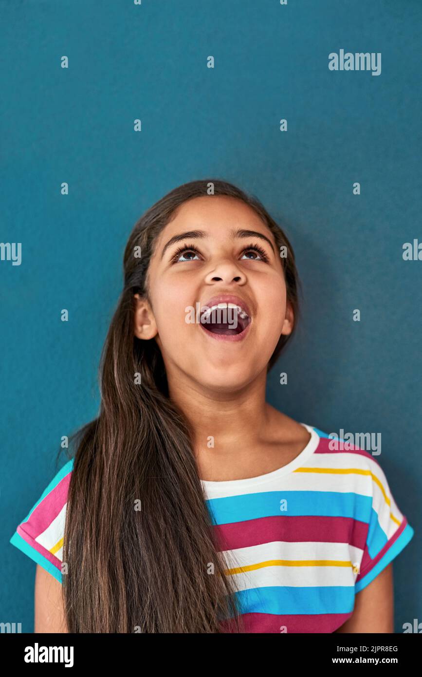 Being a kid is all fun all the time. Studio shot of an adorable little ...