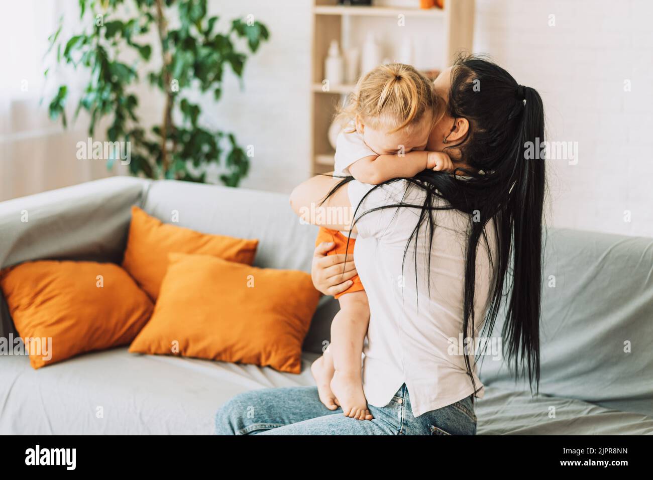 Mom hugs and soothes a crying child Stock Photo - Alamy