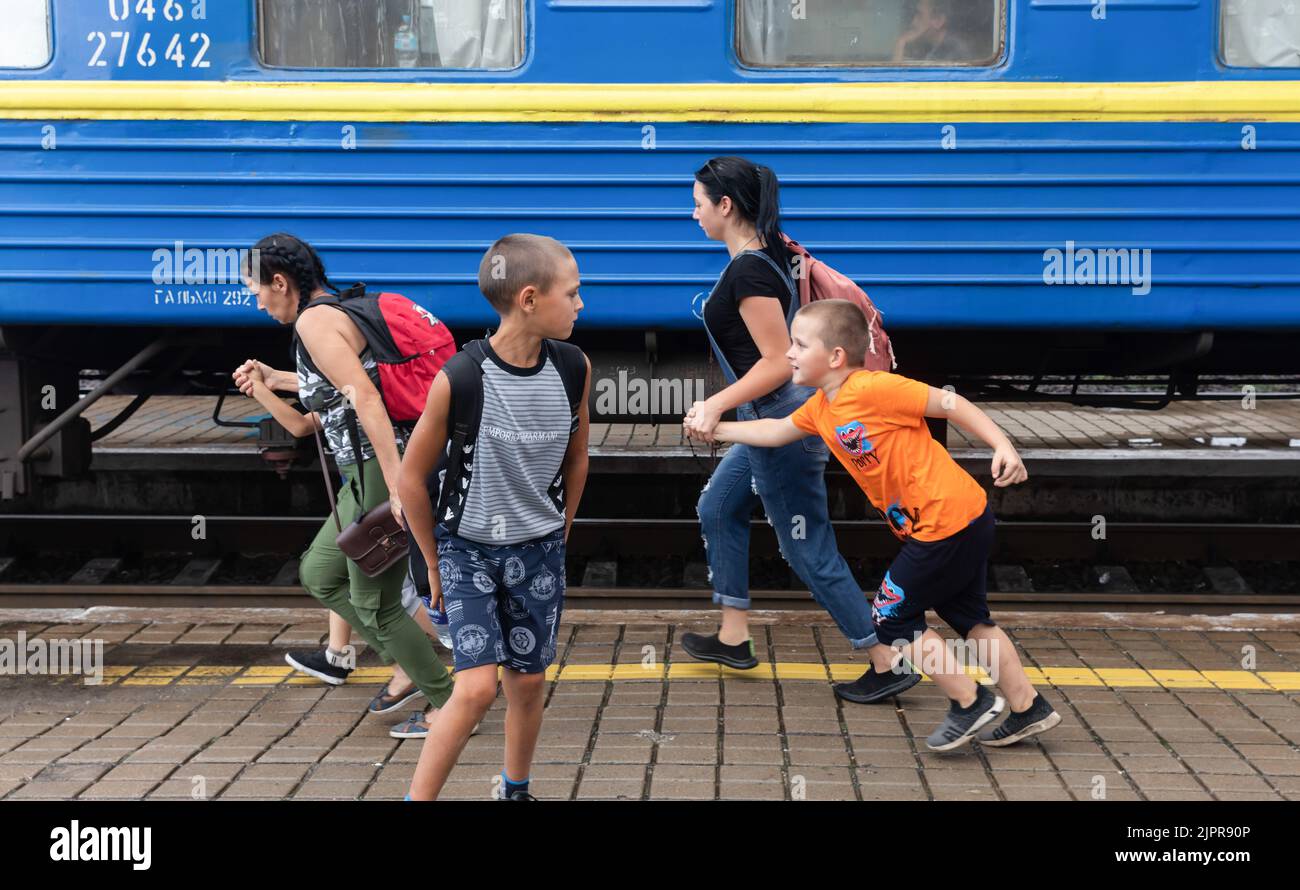 A young mother and child rush to board the train. Evacuation train from ...