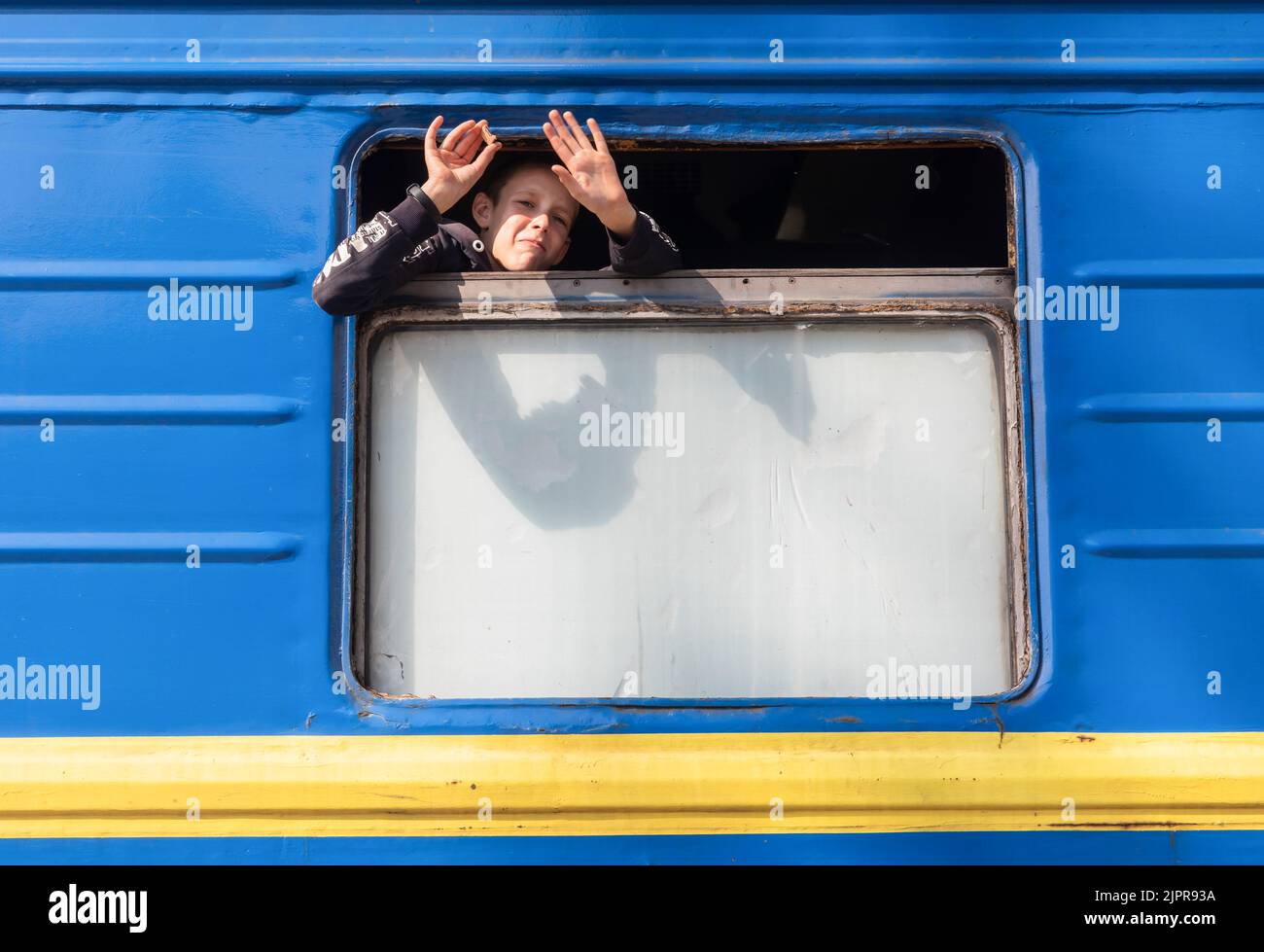 A teenage boy looks out the window of an evacuation train. Evacuation ...