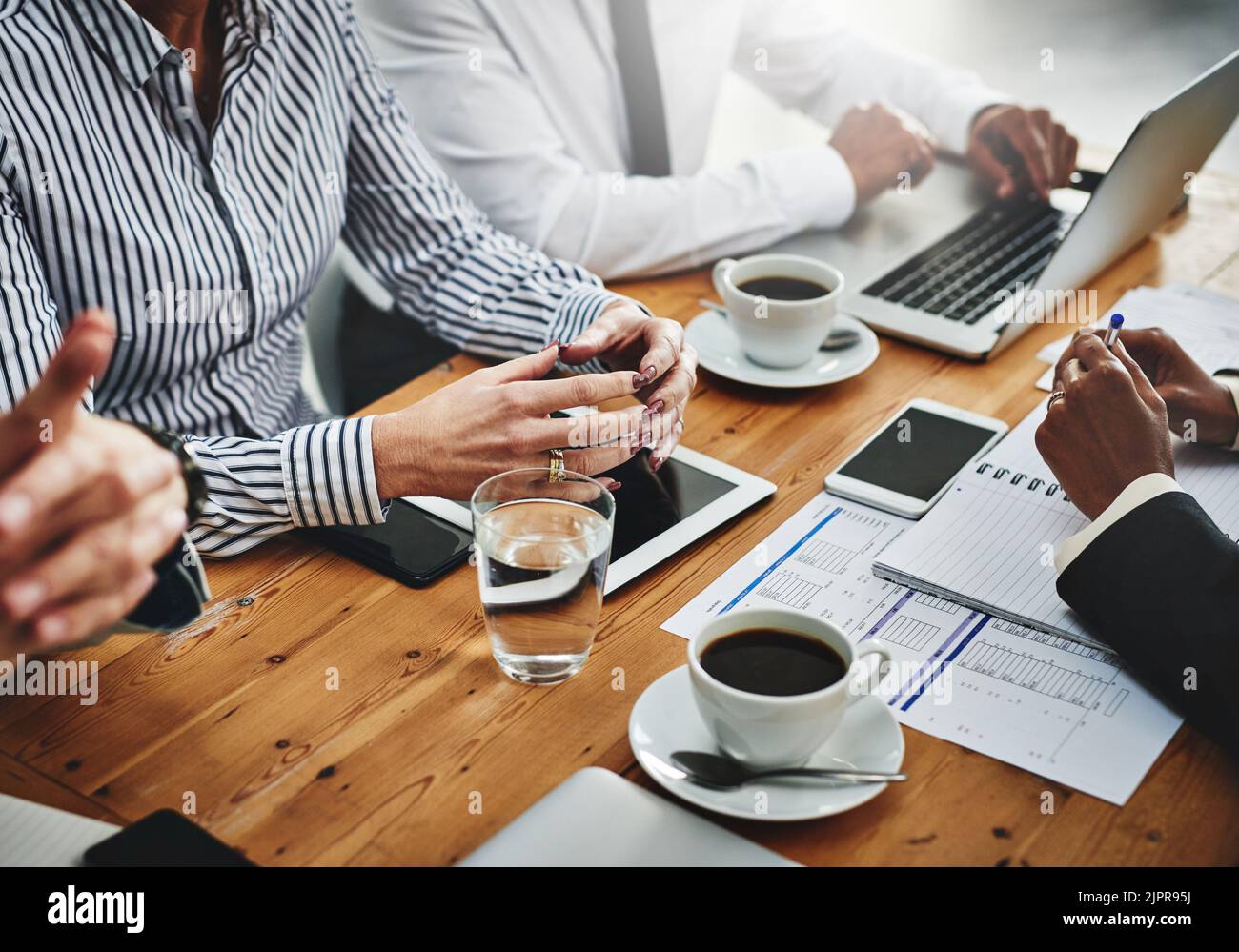 Working hard to dominate the industry. a group of unrecognisable ...