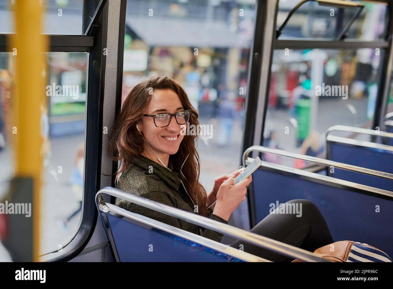 I ALWAYS take the bus. High angle portrait of an attractive young woman ...