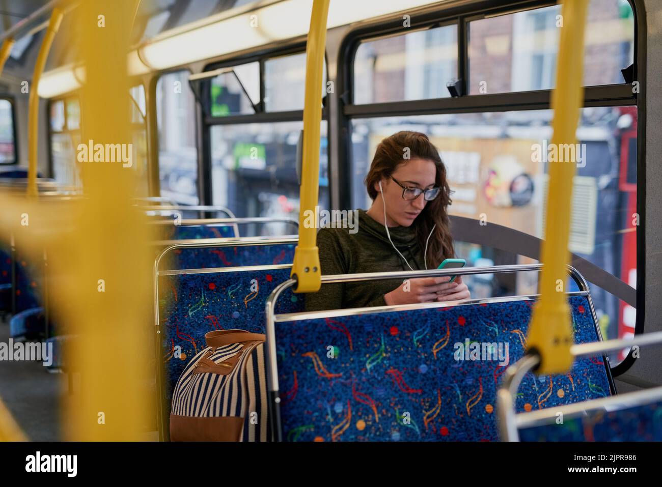 If youre gonna text, take the bus. High angle shot of an attractive ...