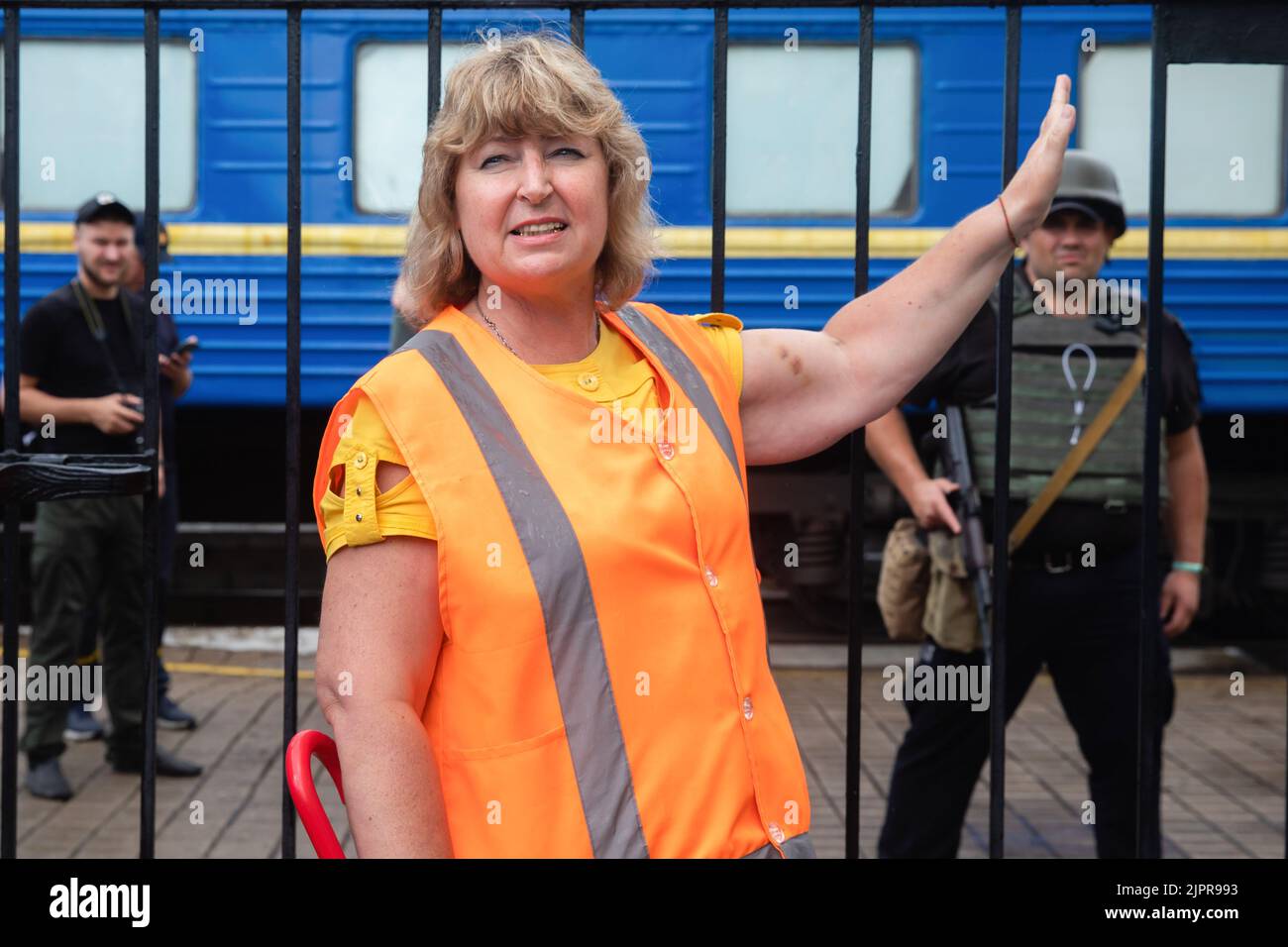 The train conductor seen against the background of employees of the ...