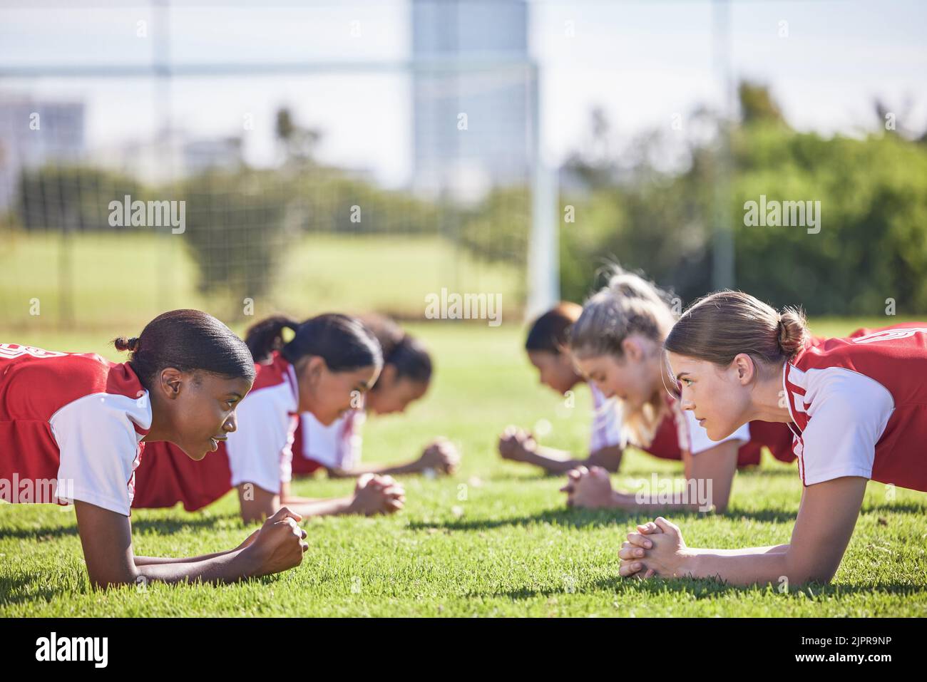 Football, soccer and plank exercise drill of girls training team ...