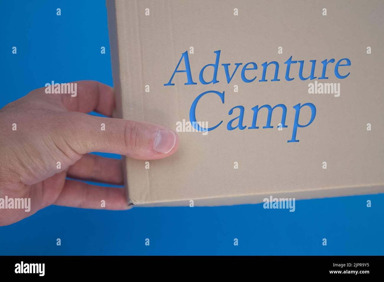 Adventure Camp word with cardboard box. Brown folded cardbox Stock ...