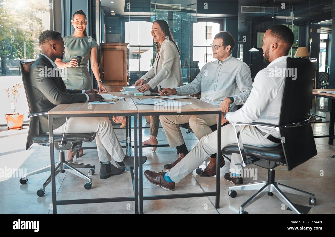 Business meeting in a boardroom of colleagues talking and planning ...