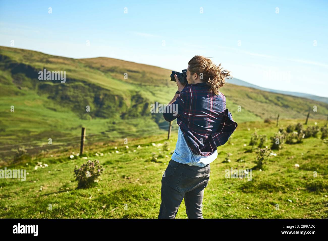 Let your camera and nature guide you. a man taking photographs with his ...
