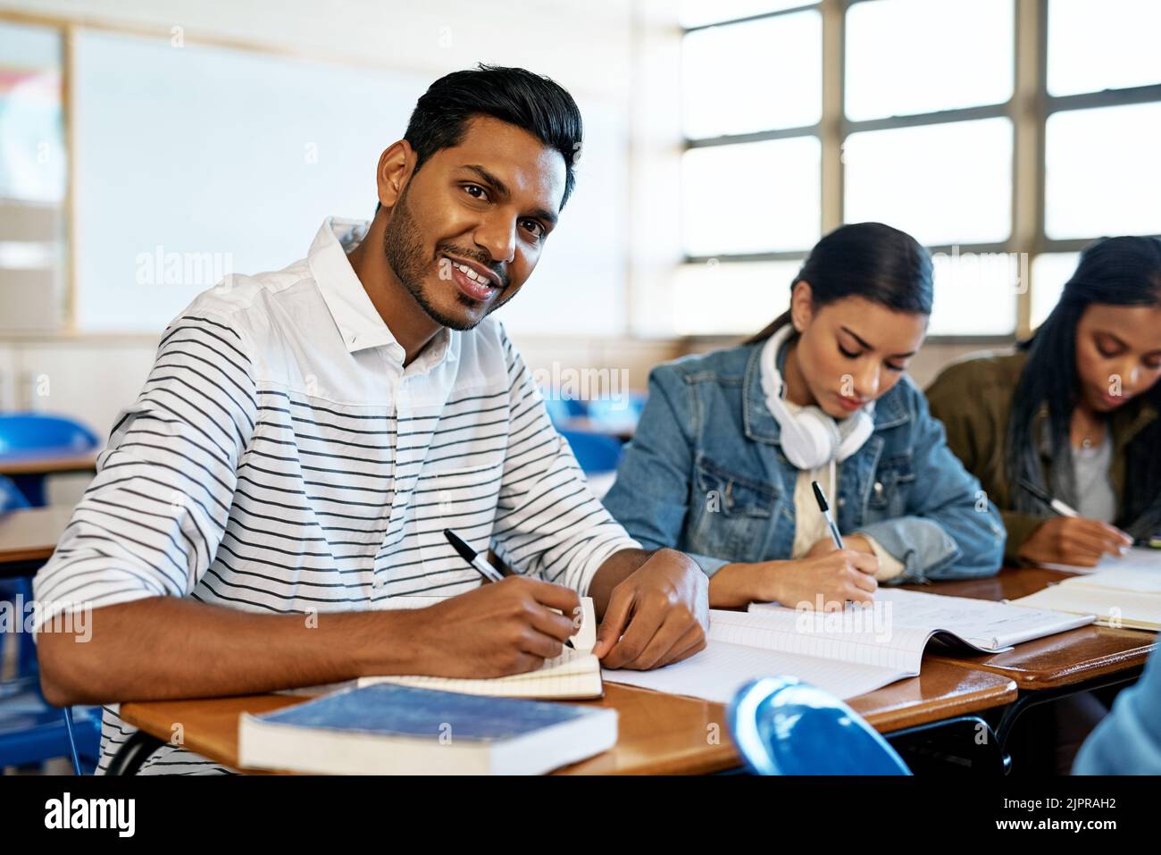 If I write it, I wont forget it. Cropped portrait of a handsome young ...