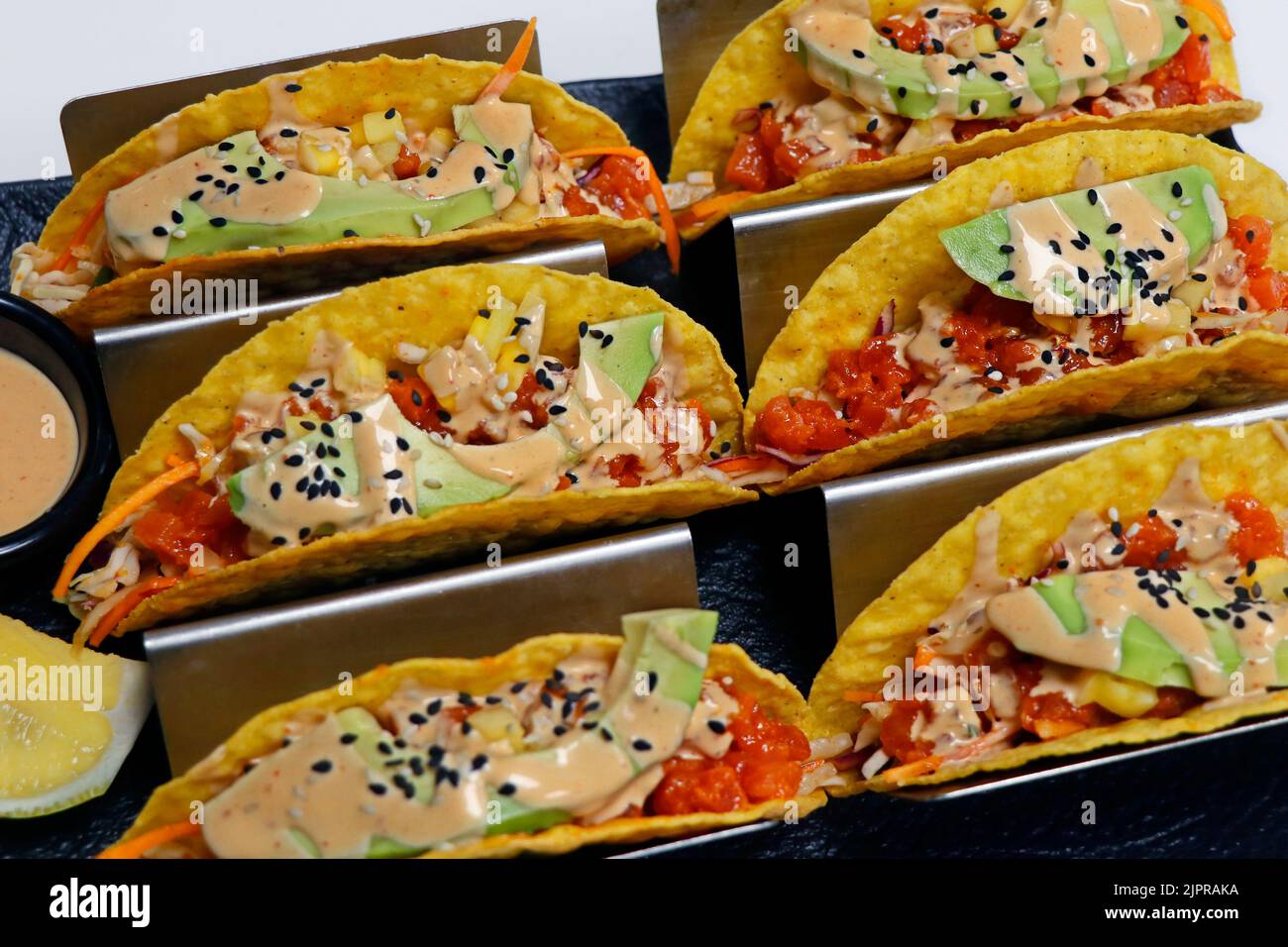 mexican style food stuffed corn taco with seafood and chicken in a ...