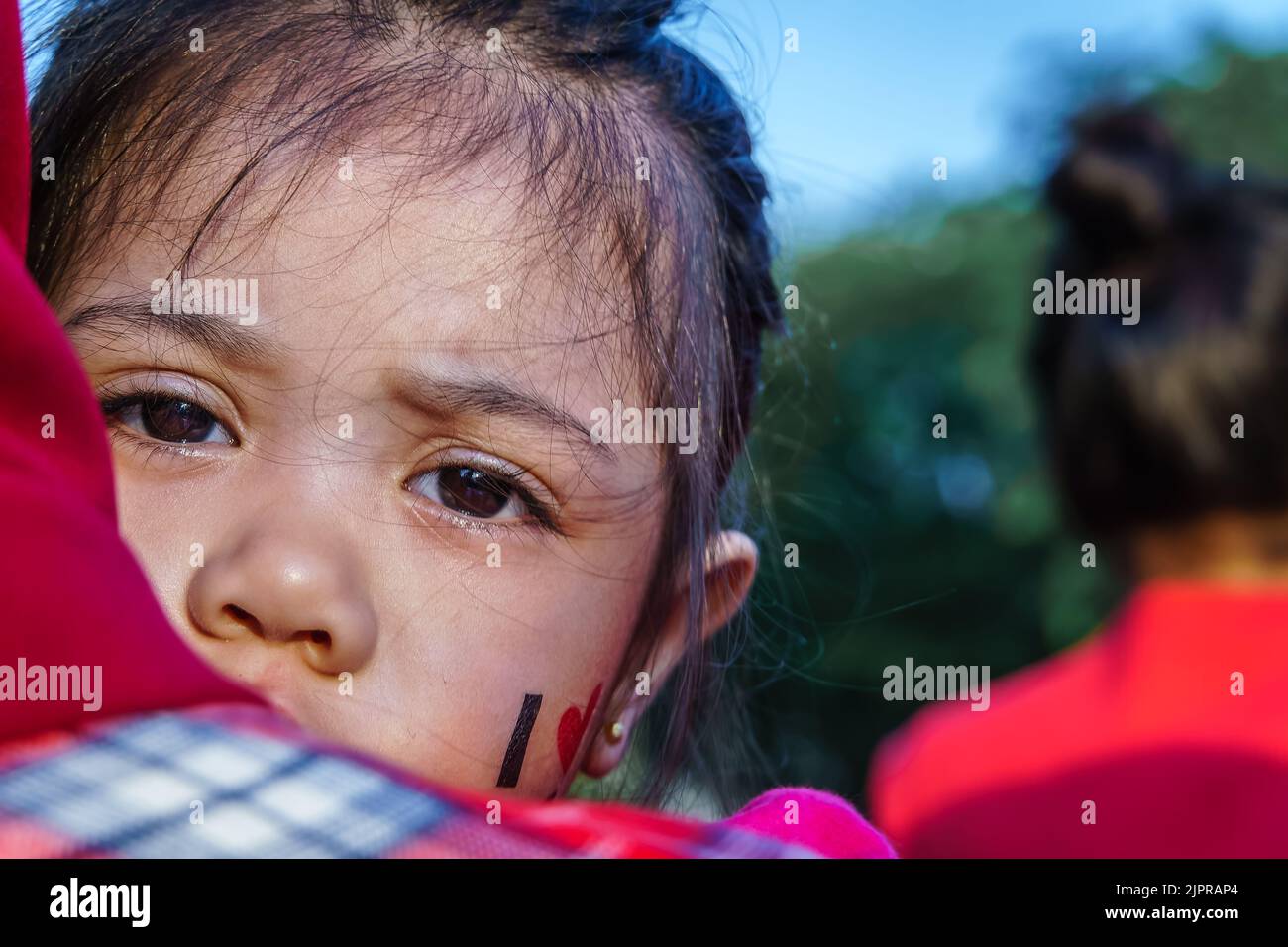 An unidentified Malay girl with "I Love SG" motif during Singapore ...