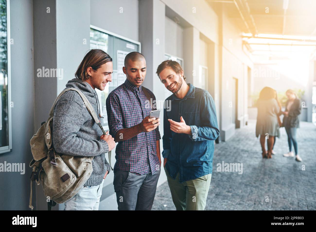 Three students standing outdoors hi-res stock photography and images ...