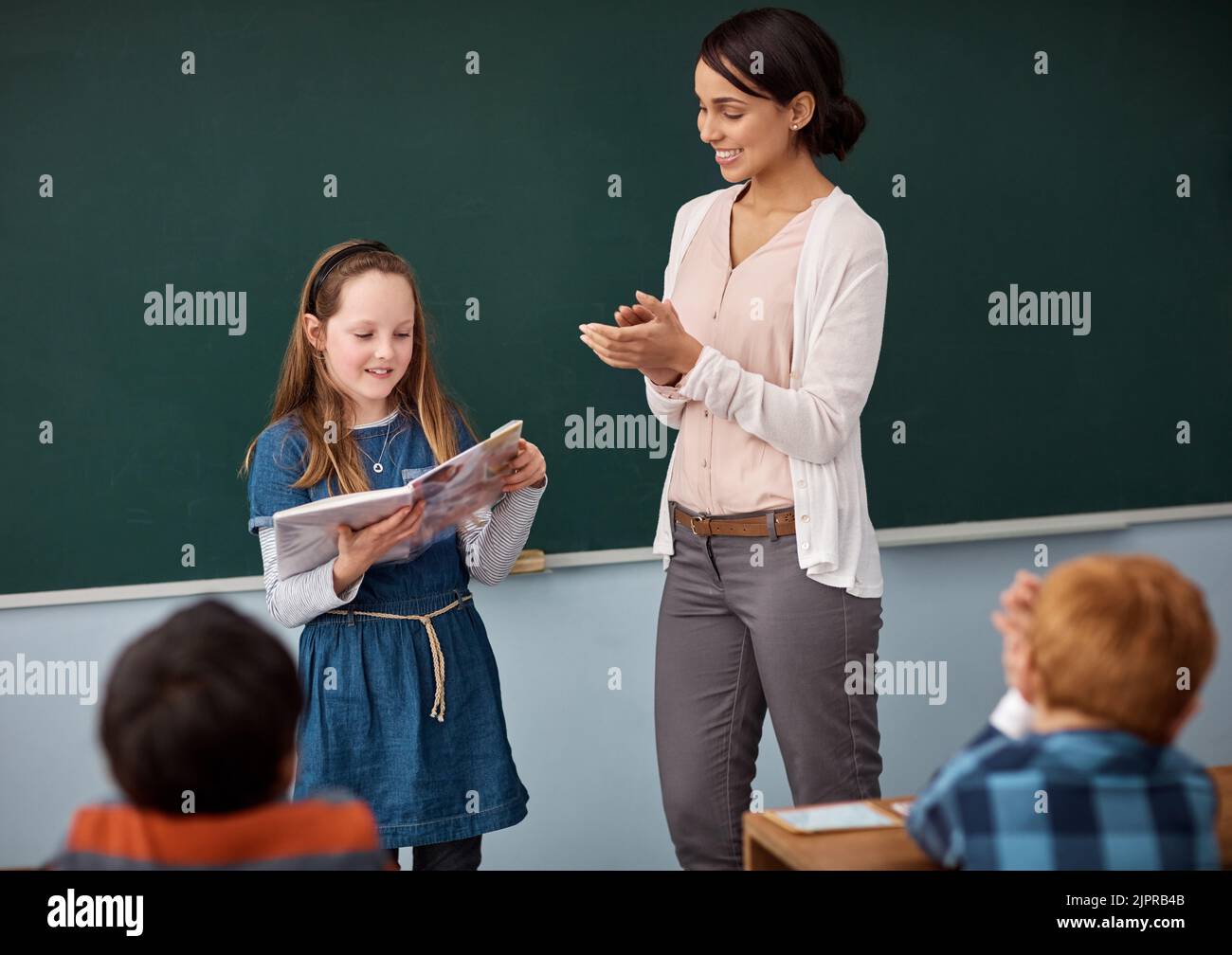 Shes prepared an excellent show-and-tell for the class. a teacher ...