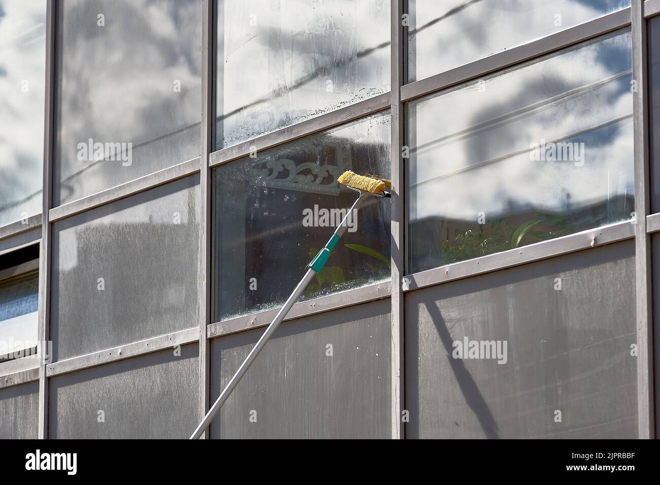 window washing, washing a street shop window Stock Photo - Alamy