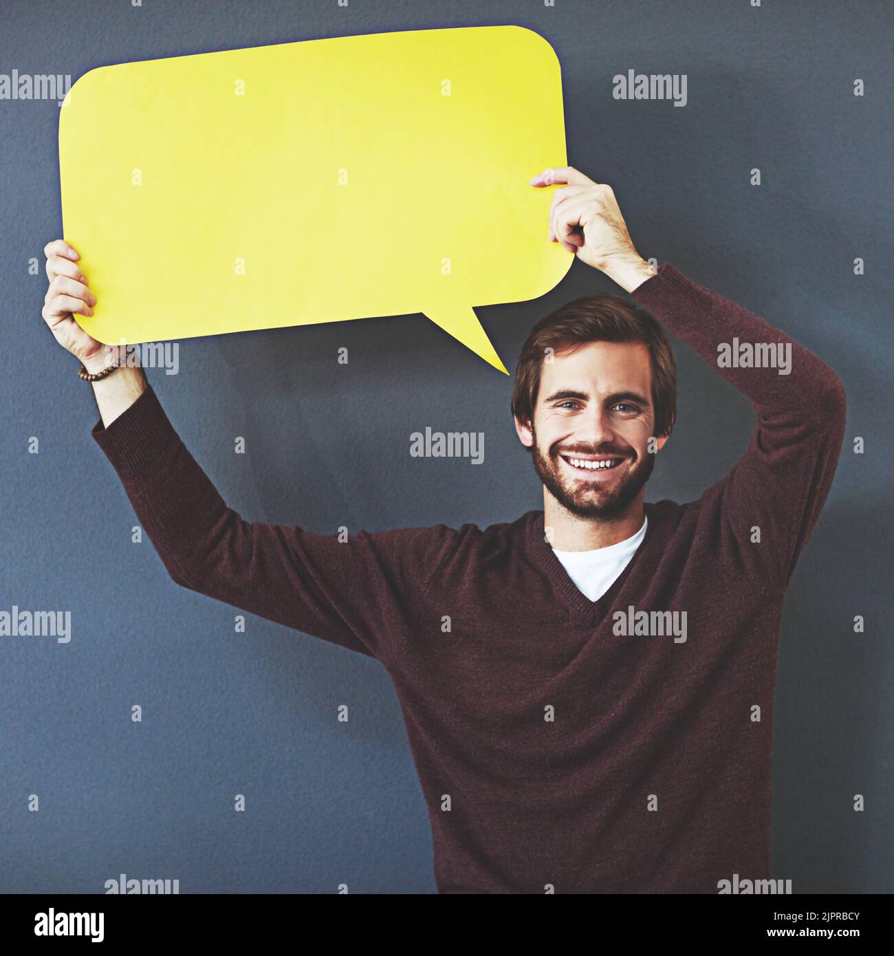 Hes such a chatterbox. Studio portrait of a young man holding a speech ...