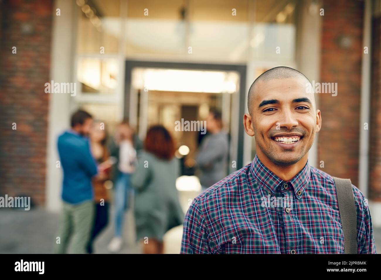 My education is first priority. Portrait of a happy young man standing ...
