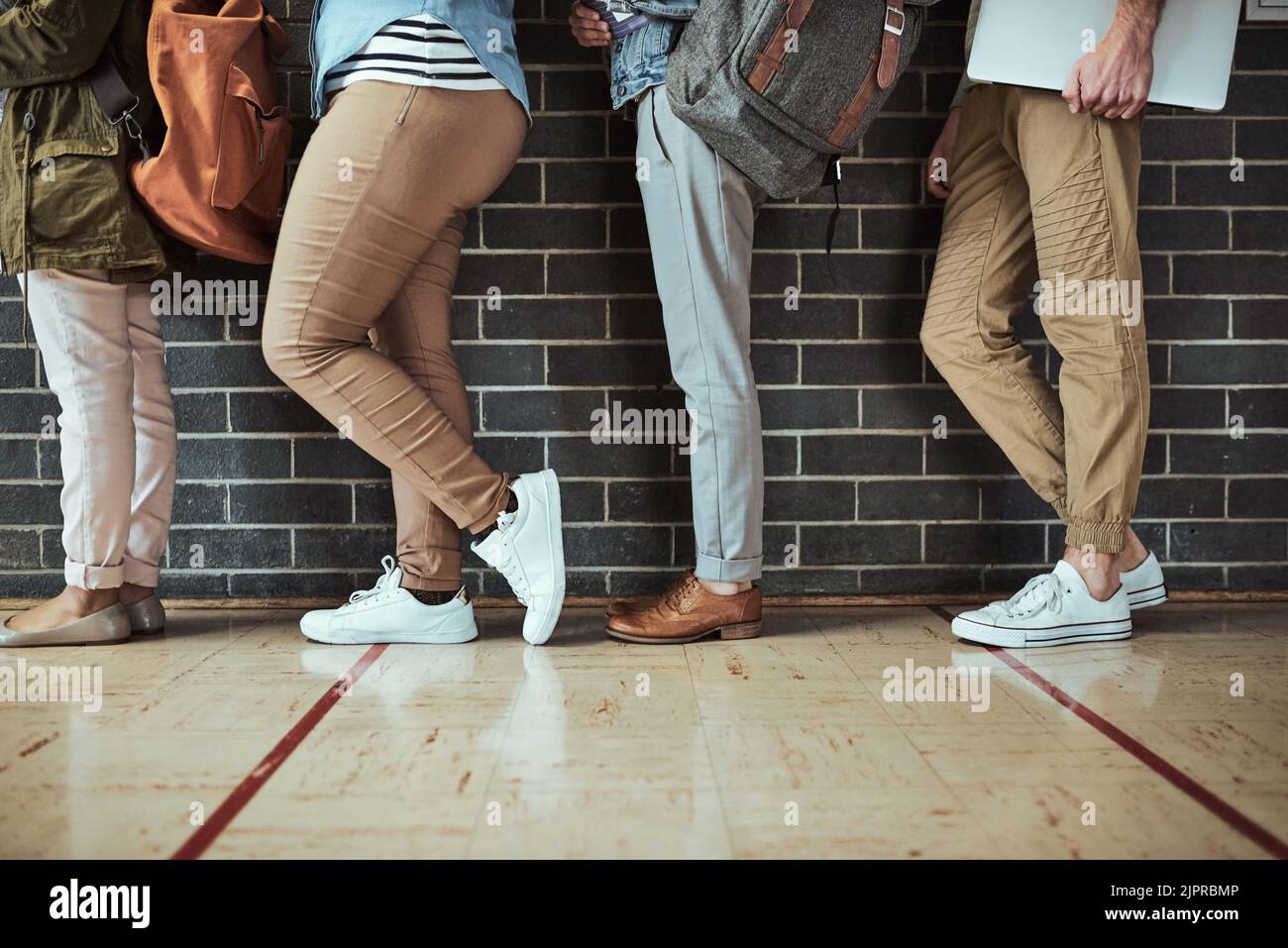 Waiting in line. a. group of unrecognizable university students ...