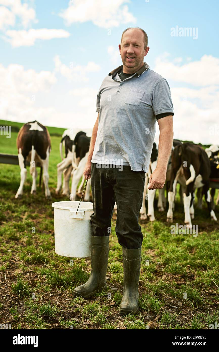 I take good care of my cattle. Full length portrait of a male farmer ...