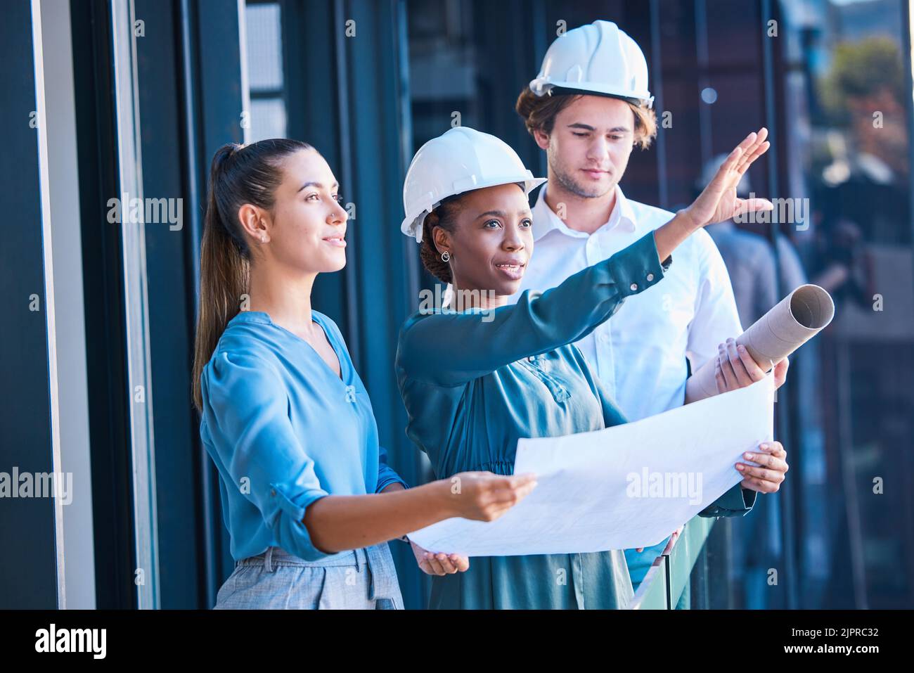 Building construction management team with an architect and engineering ...