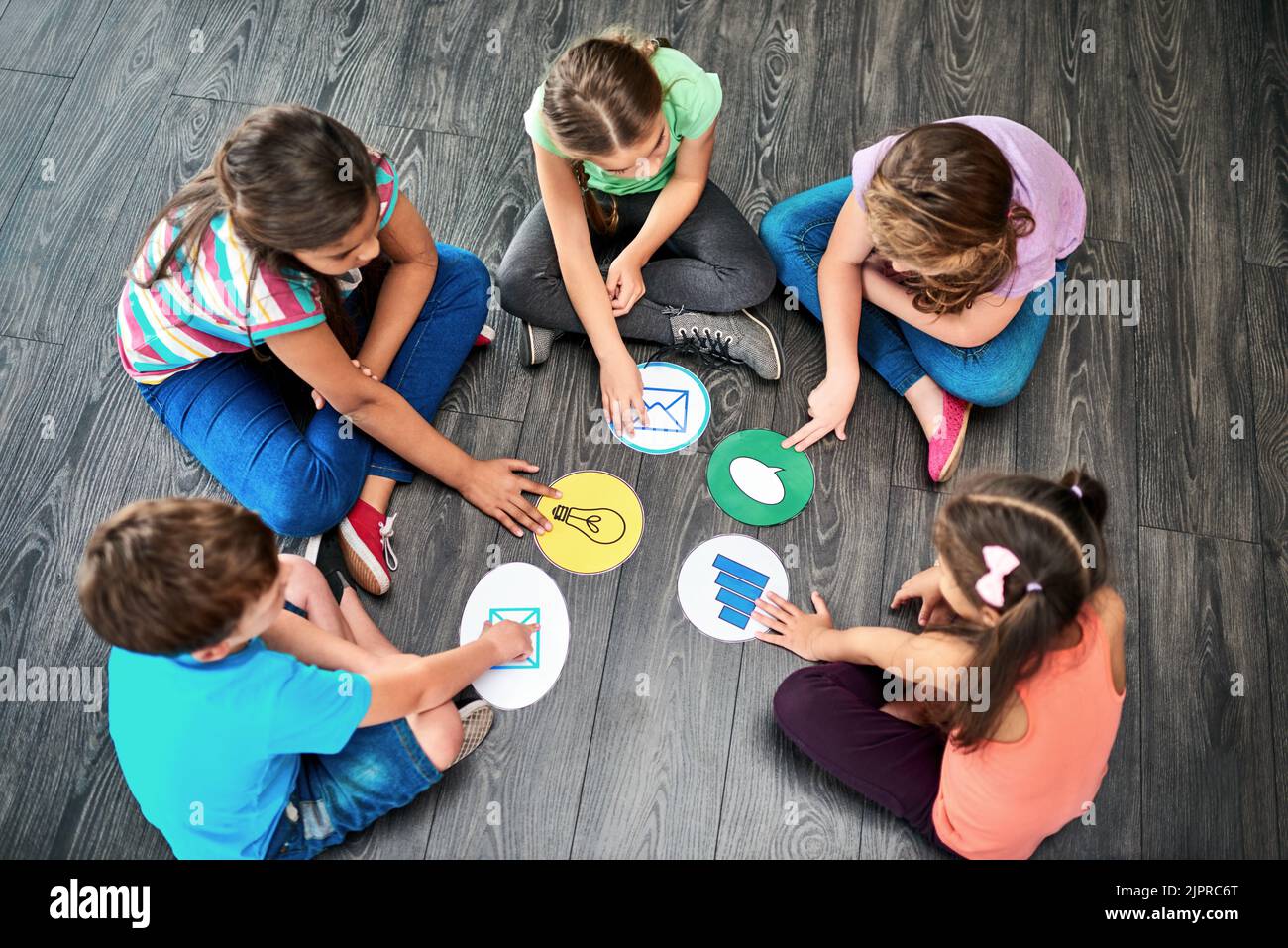 Learn and play everyday. High angle shot of a group of kids playing a ...