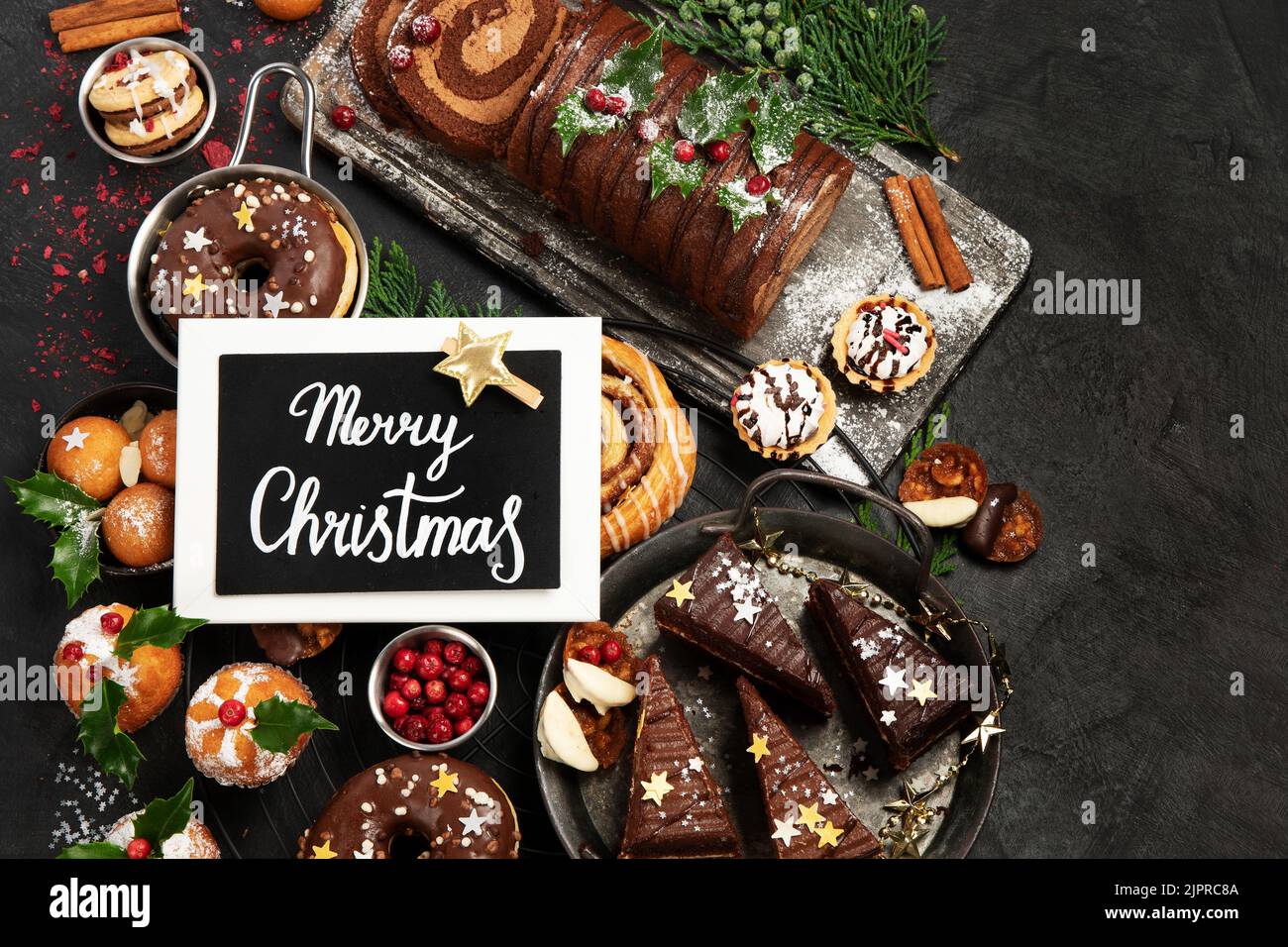 Traditional Christmas dessert on dark background. Holiday food. Top ...