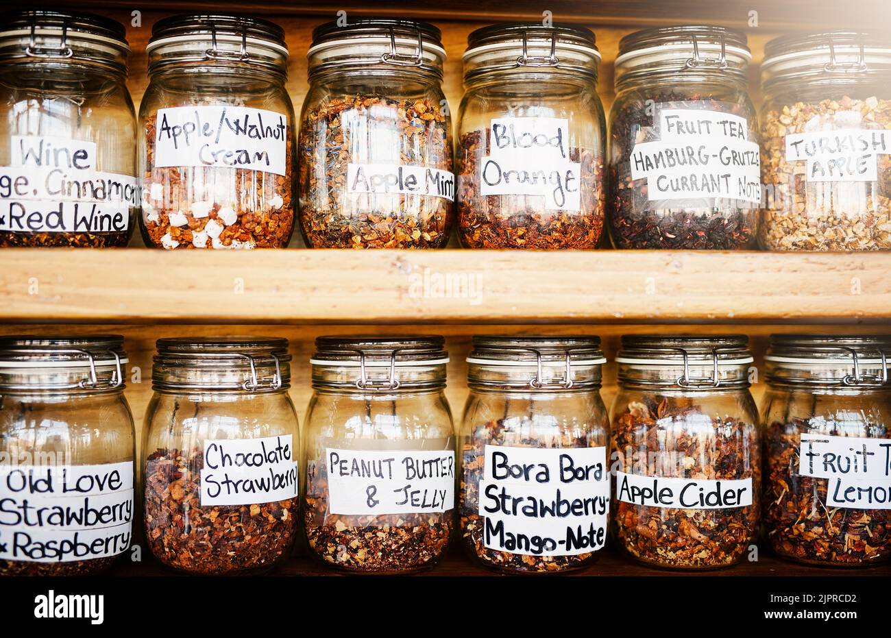 Theres a blend for everyone. jars of various teas packed on shelves ...