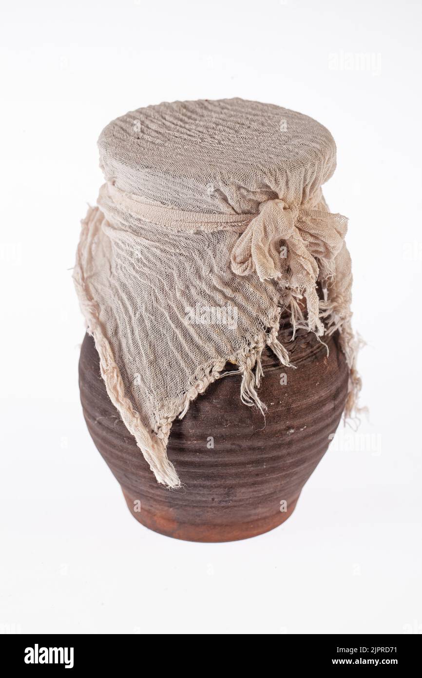 Old ceramic pot on an isolated studio background Stock Photo - Alamy