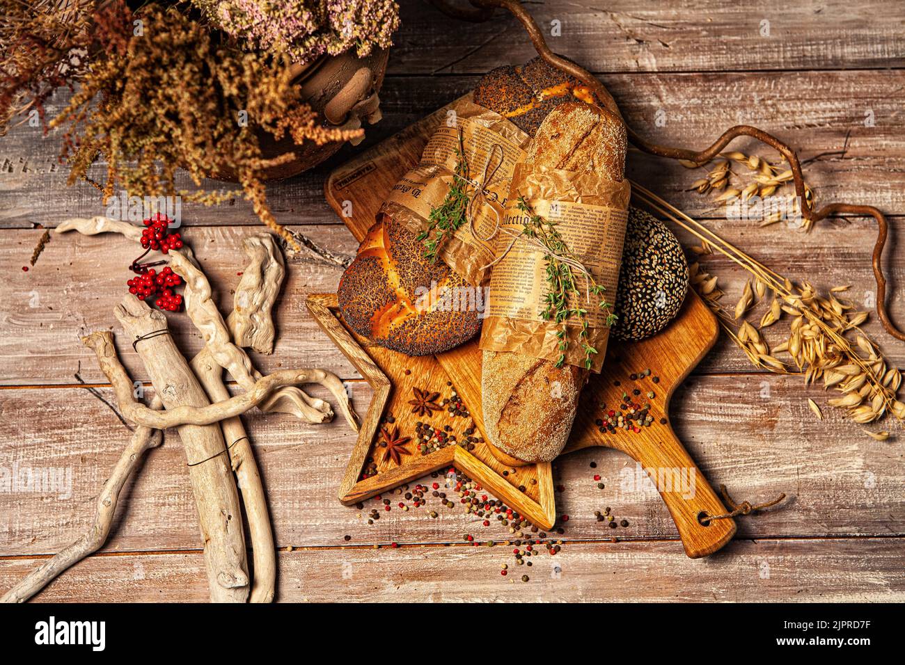 Different kinds of bread on a wooden desk Stock Photo - Alamy