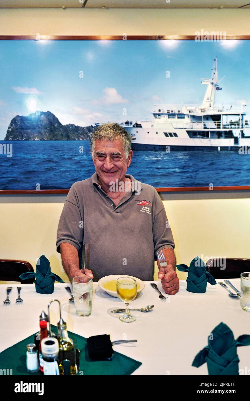 Senior tourist, guest at the Okeanoss aggressor table, liveaboard ...