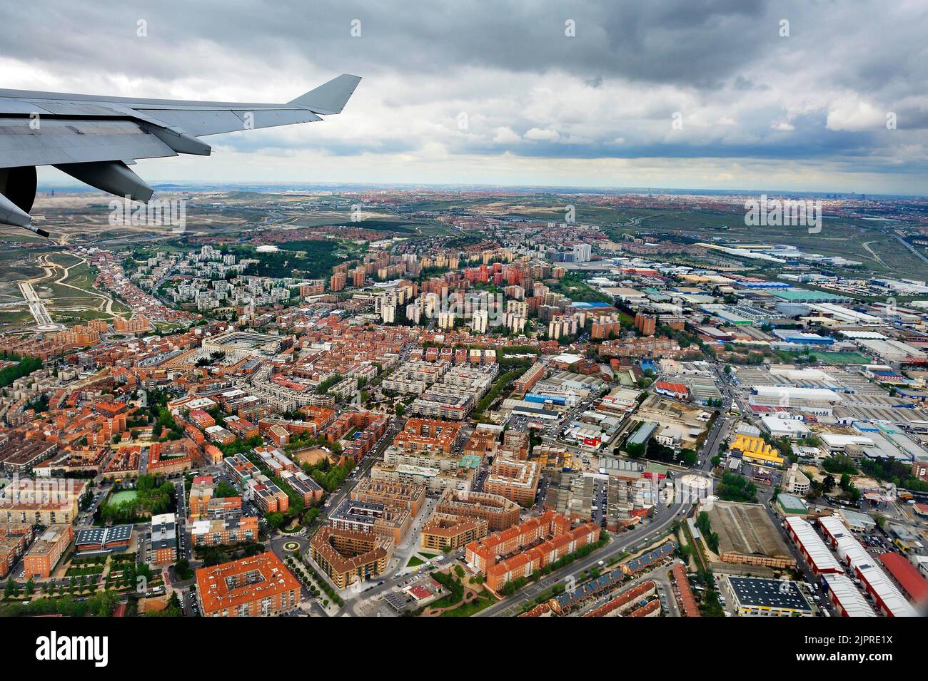 Aerial view, Madrid suburb with high-rise buildings and factories ...