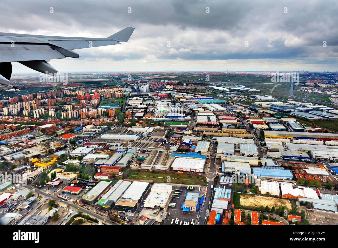 Aerial view, Madrid suburb with high-rise buildings and factories ...