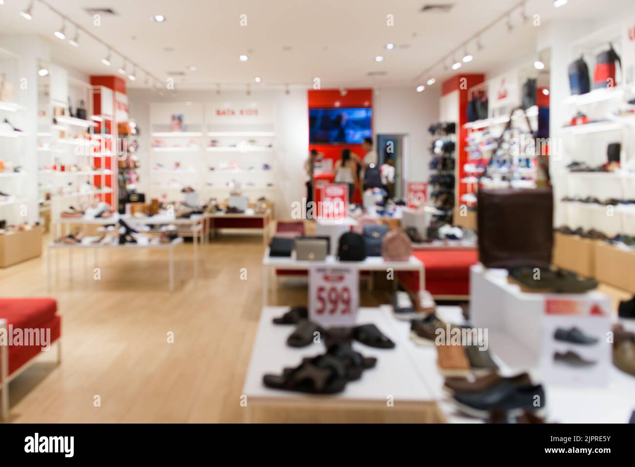 Blurred showcases fashion boutique Clothing store in a modern shopping ...