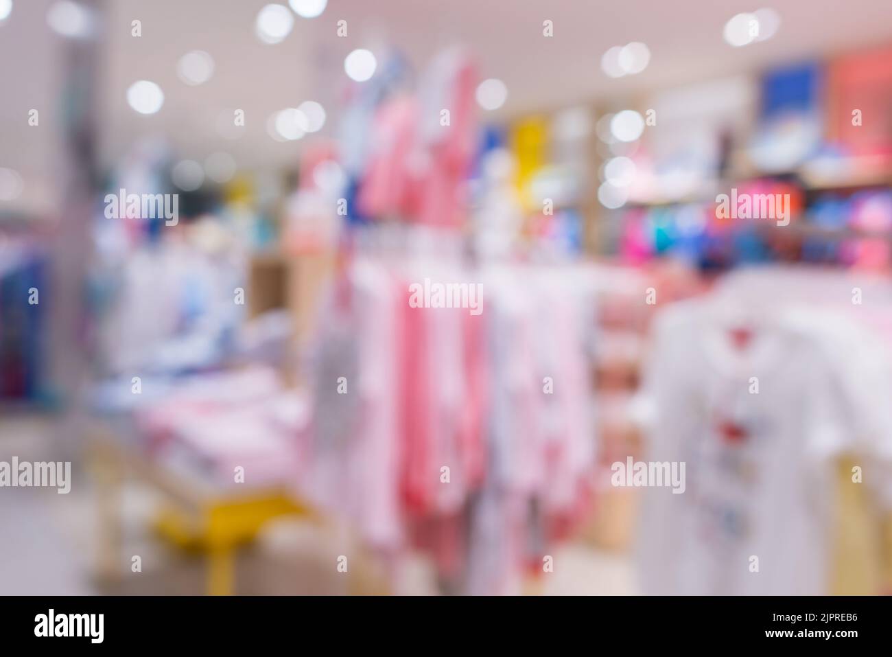 Blurred showcases fashion boutique Clothing store in a modern shopping ...