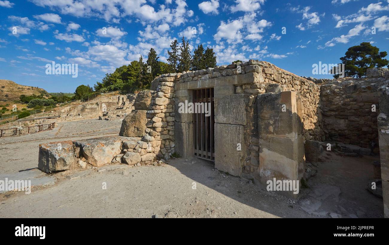 Morning light, blue sky, white clouds, stone building, lattice door ...