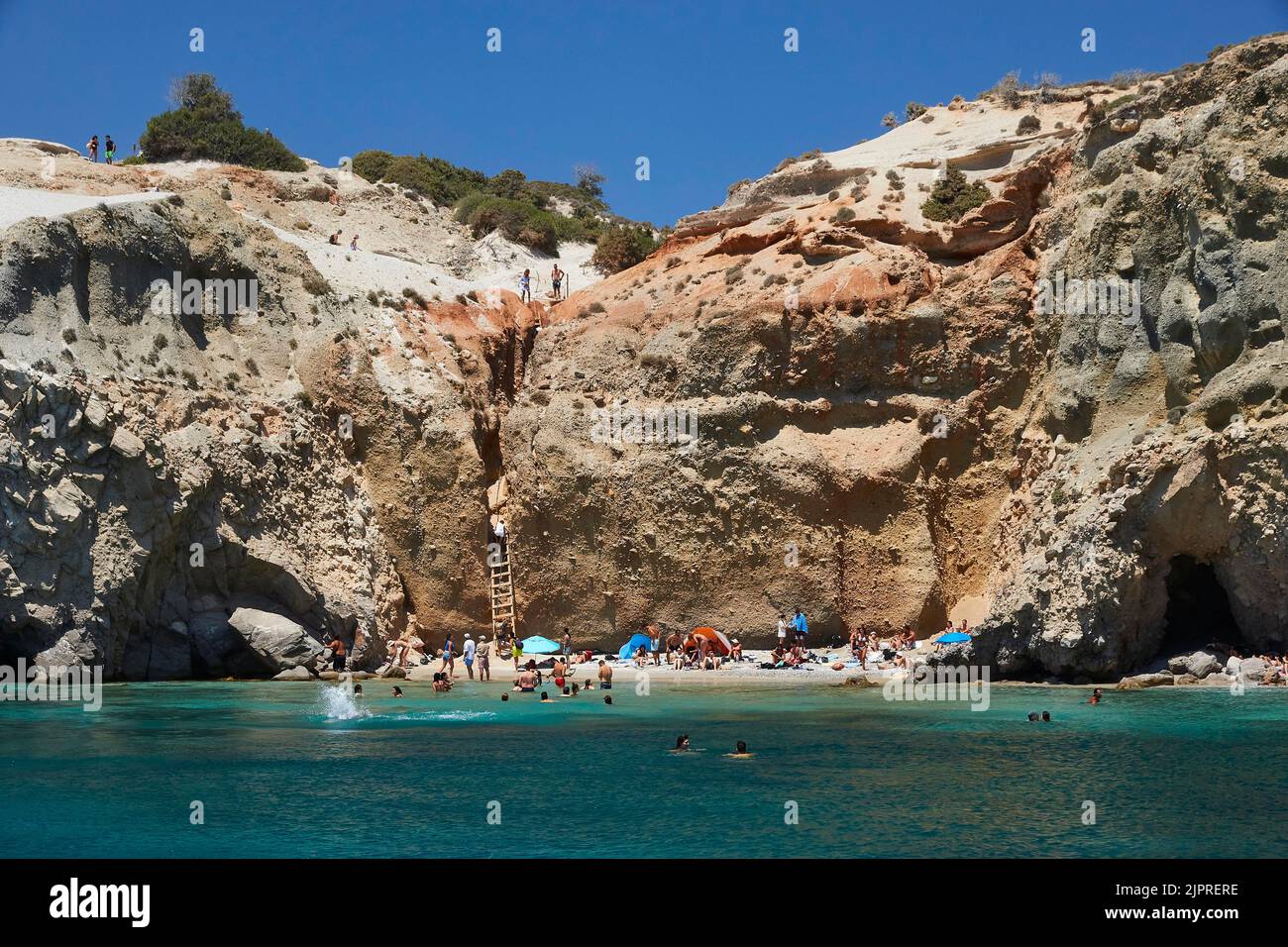 Sarakiniko Beach, colourful lava rocks, sandy beach, tourists, ladder ...