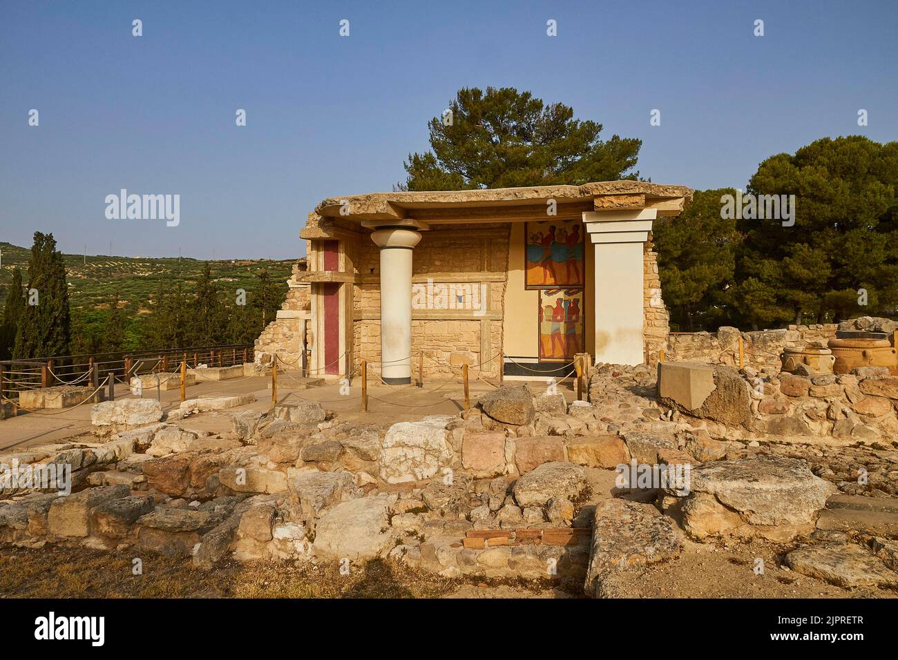 Morning light, blue cloudless sky, walls, trees, southern propylaea, fresco, rhyton support ...
