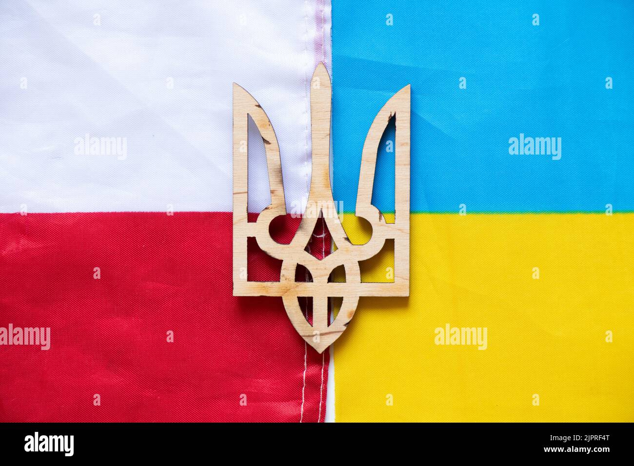 The Ukrainian trident lies on the flags of Poland and Ukraine, the ...
