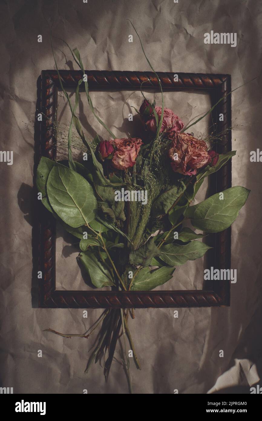 Dried Roses on Wooden Frame Stock Photo - Alamy
