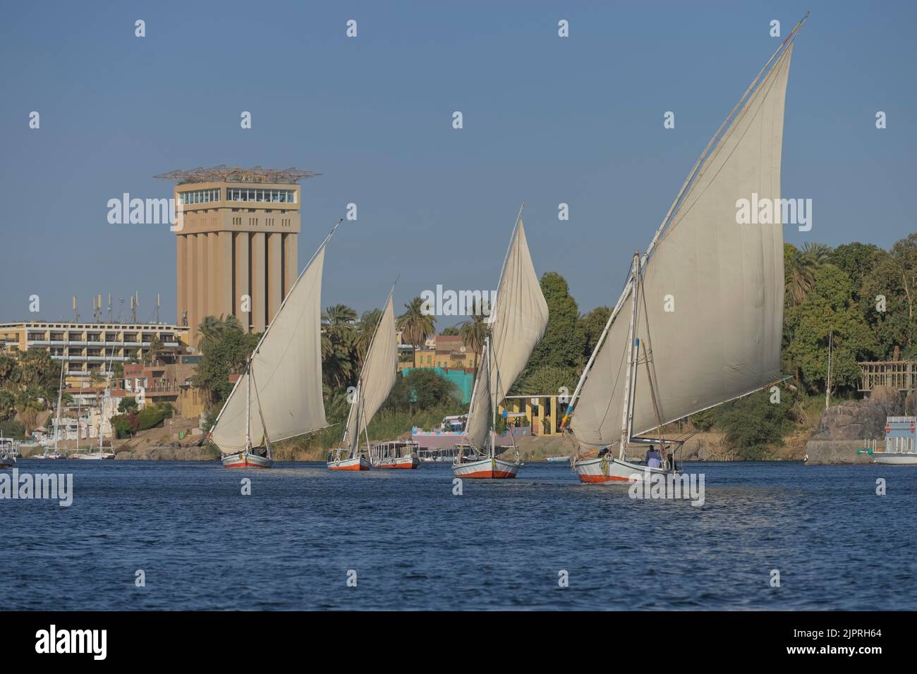 Sailing boats, excursion boats on the Nile at Aswan, Egypt Stock Photo ...