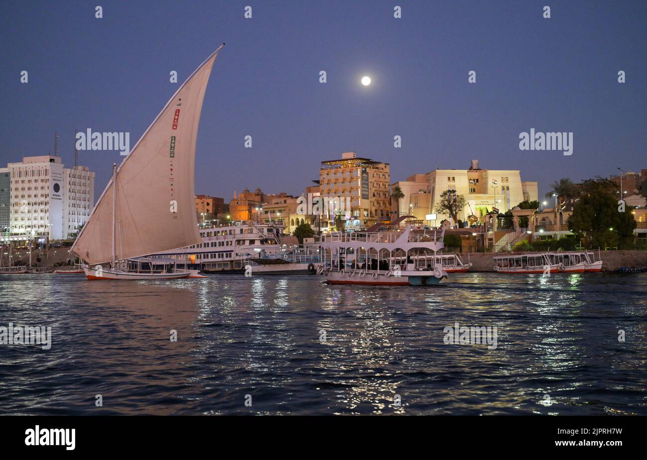 Full moon, sailing ship and excursion boats on the evening Nile near ...