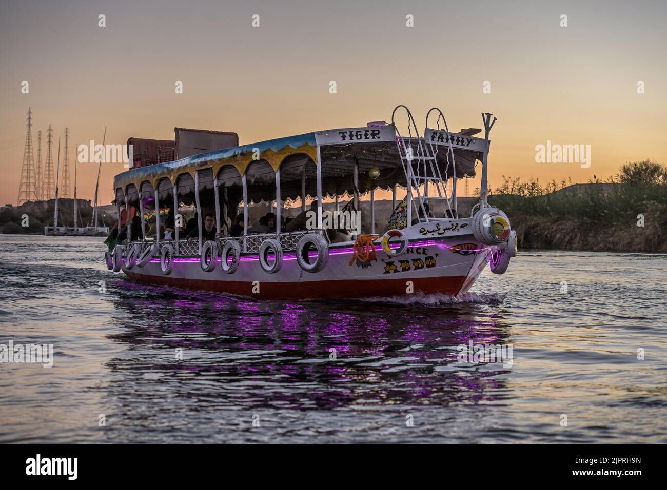 Illuminated excursion boat on the Nile near Aswan, Egypt Stock Photo ...
