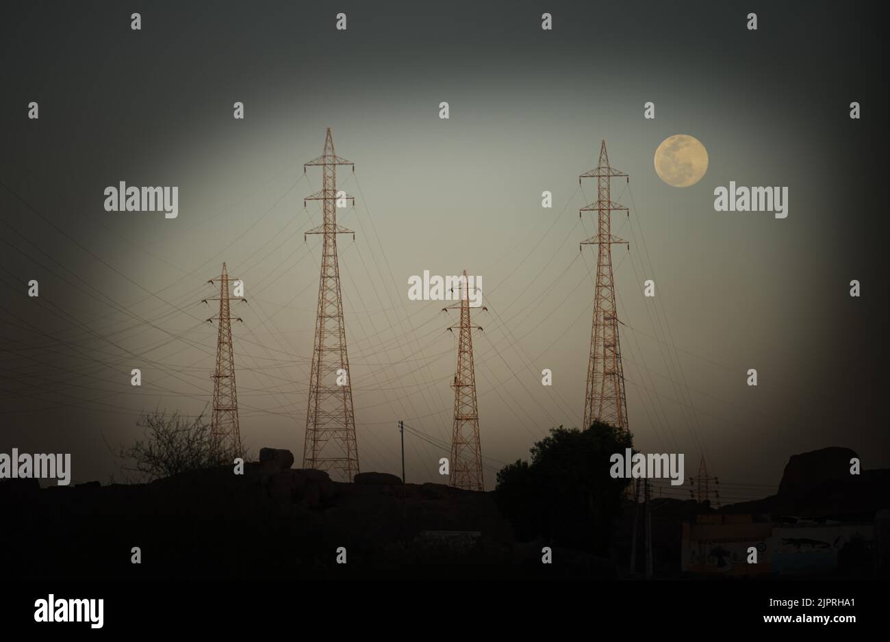 Full moon, electricity pylons near Aswan, Egypt Stock Photo - Alamy